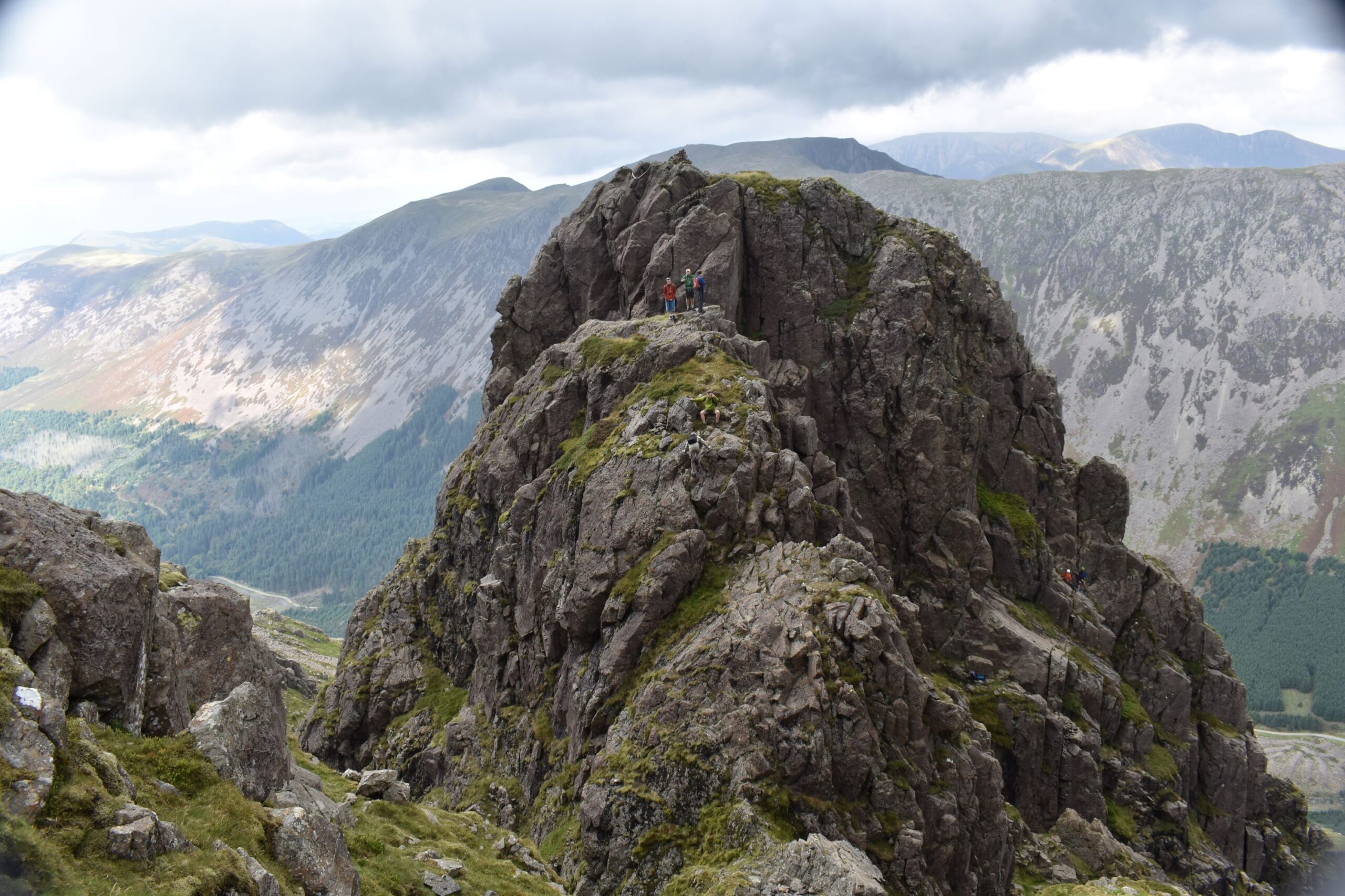 A Group on the top of Pisgah with Pillar Rock behind | Lakeland Walking Tales
